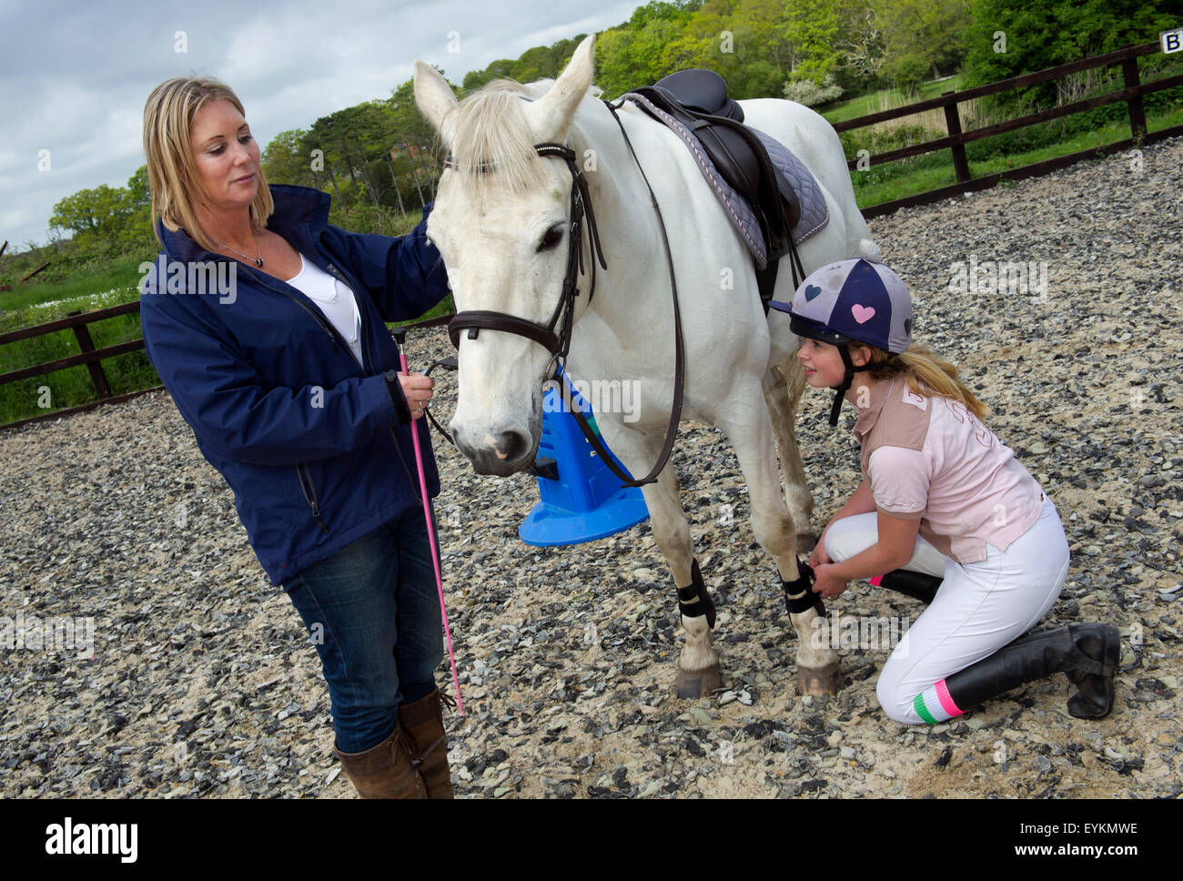 Ella Manning training her horse 'Turner' in a showjumping arena ...