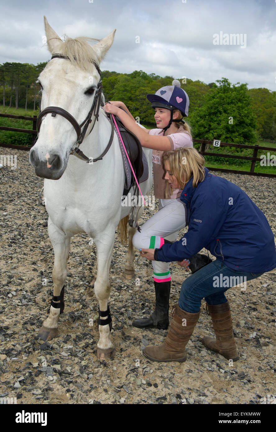 Ella Manning training her horse 'Turner' in a showjumping arena ...