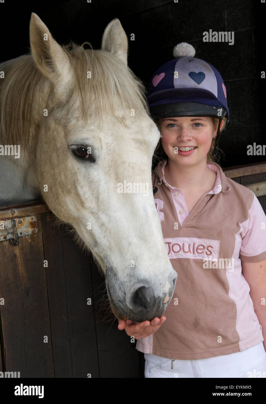 Ella Manning training her horse 'Turner' in a showjumping arena ...