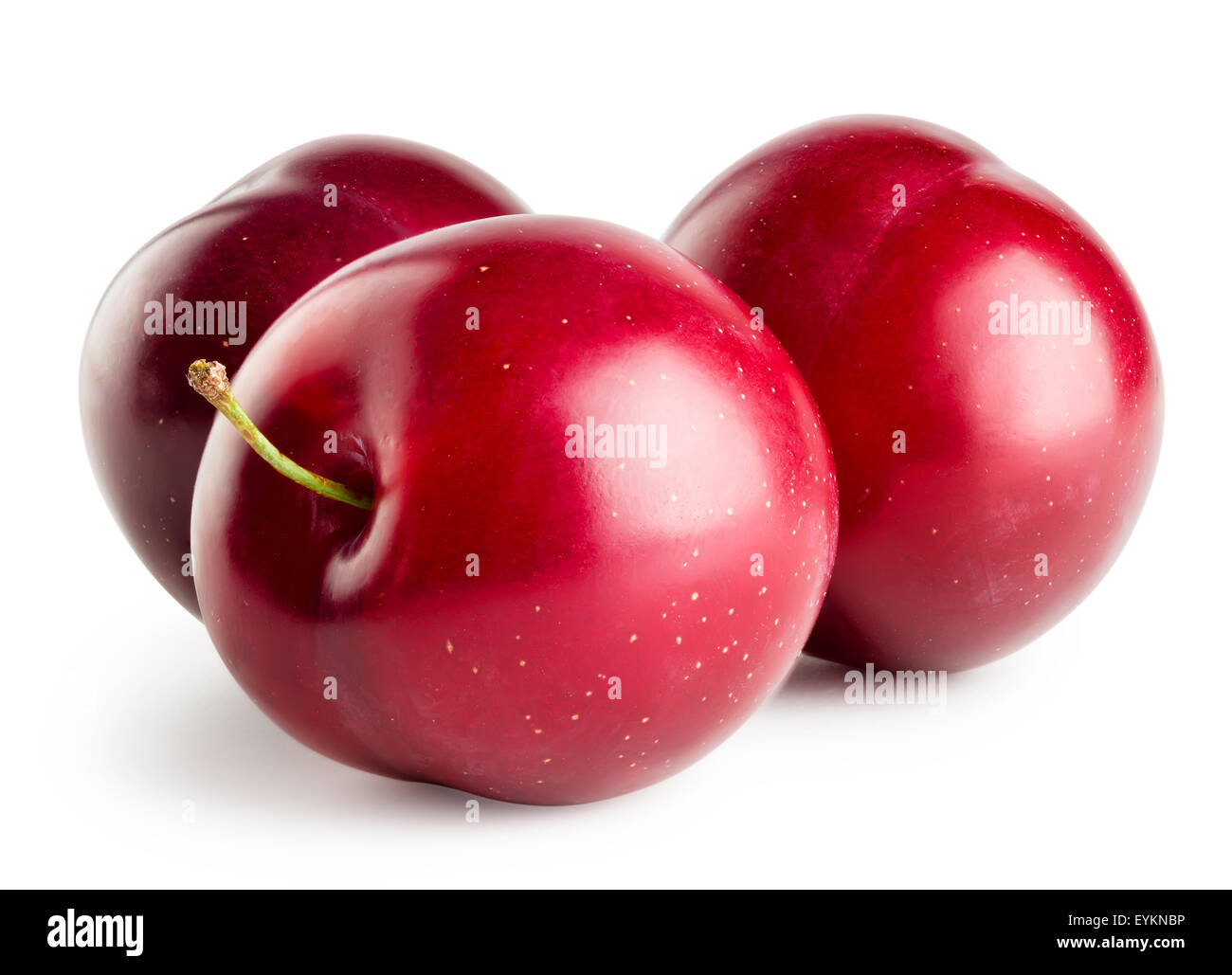 Three juicy plum isolated on a white background Stock Photo - Alamy