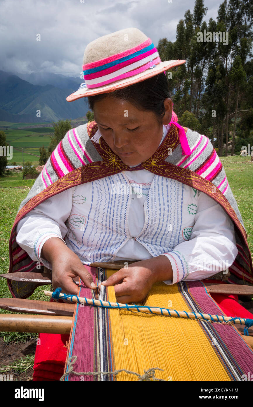 Quechua woman weaving cloth in village of Misminay, Sacred Valley, Peru ...