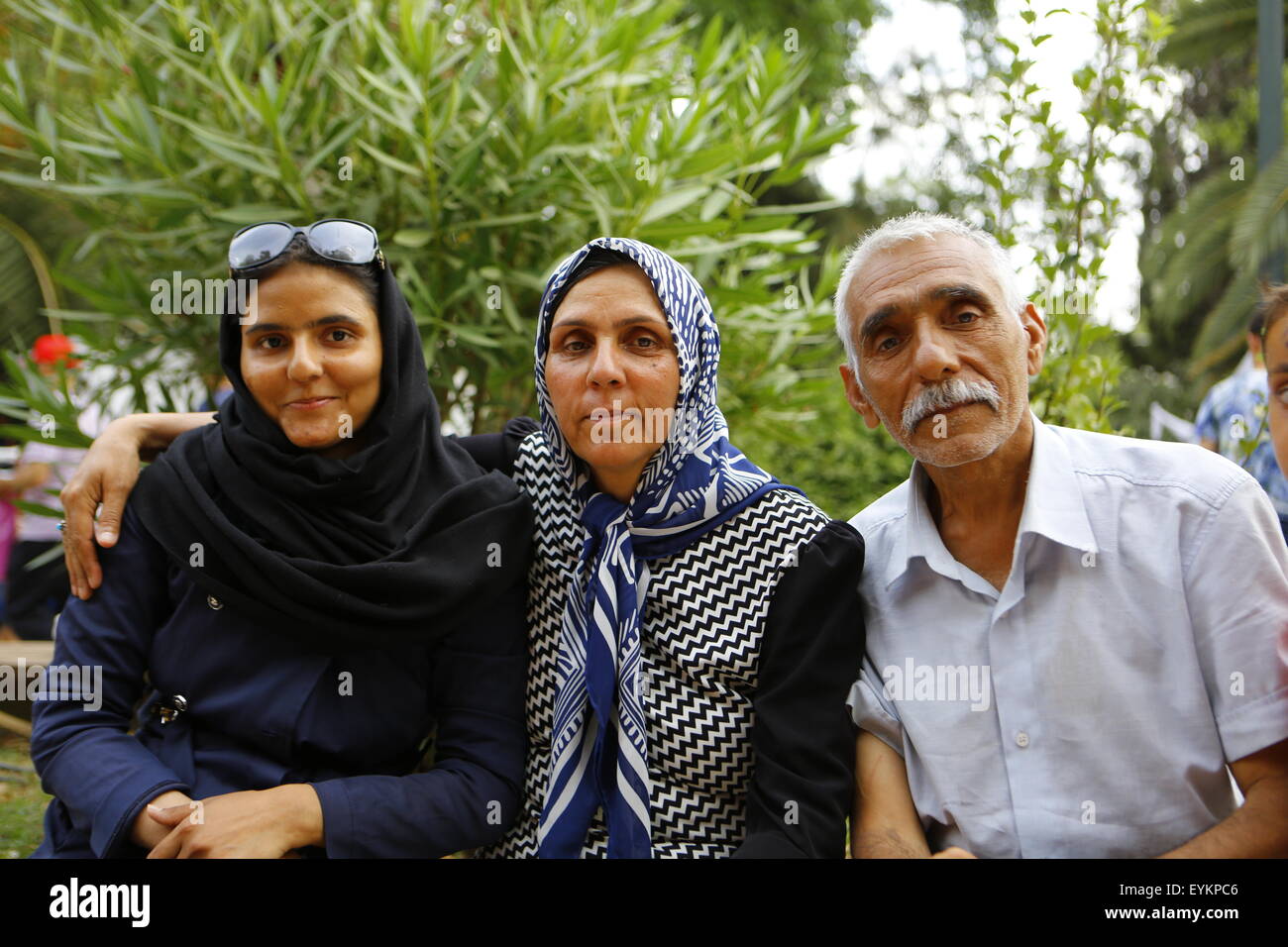 Athens, Greece. 31st July 2015. An Afghan family poses for a photo in ...