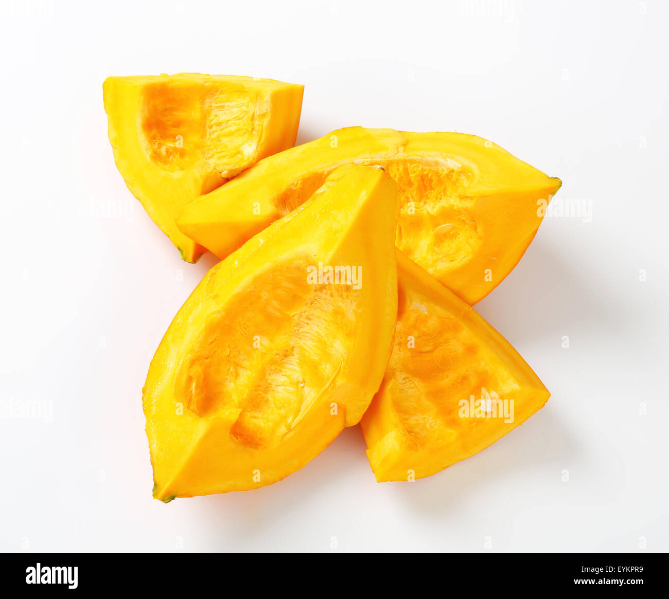 Studio shot of yellow pumpkin quarters Stock Photo - Alamy