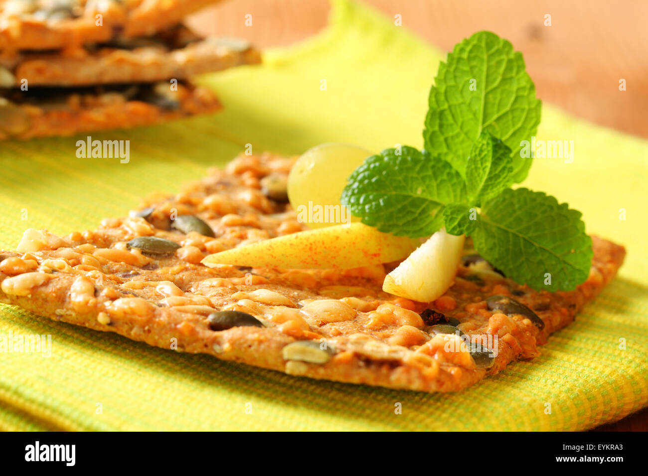 Whole grain cracker with cheddar and pepitas Stock Photo - Alamy