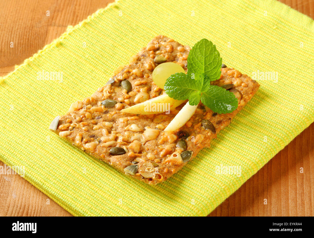 Whole grain cracker with cheddar and pepitas Stock Photo - Alamy