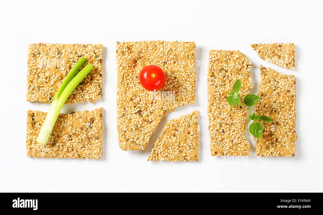 Whole wheat crackers with sesame seeds and chopped herbs Stock Photo ...
