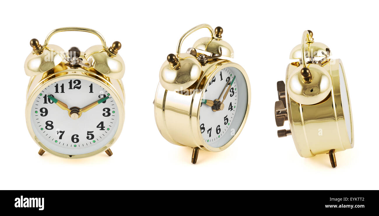Golden mechanical alarm clock isolated Stock Photo - Alamy