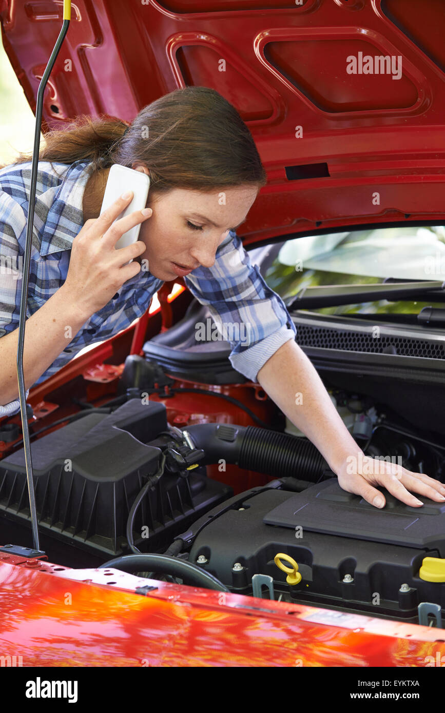Female Motorist Phoning For Help After Breakdown Stock Photo - Alamy