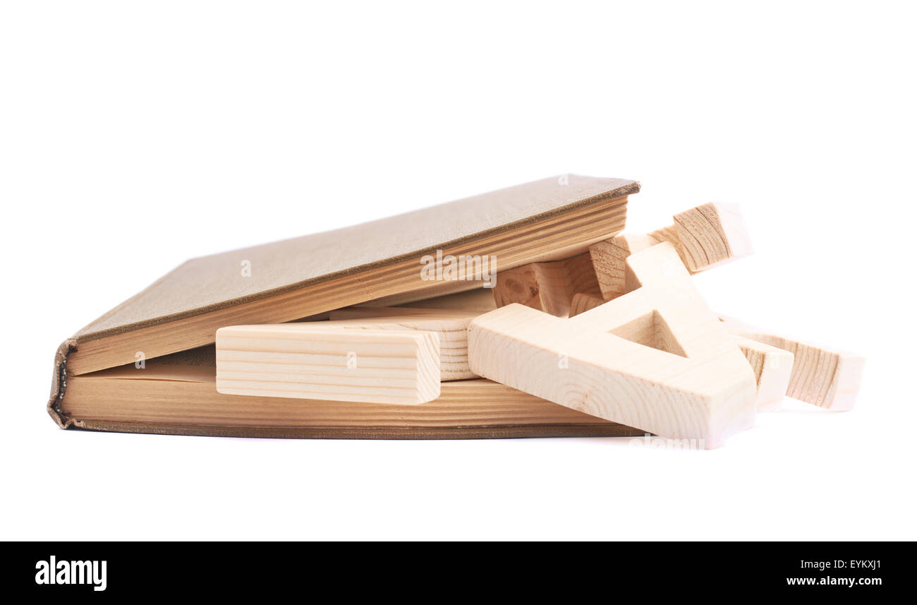 Closed book with the wooden letters Stock Photo - Alamy