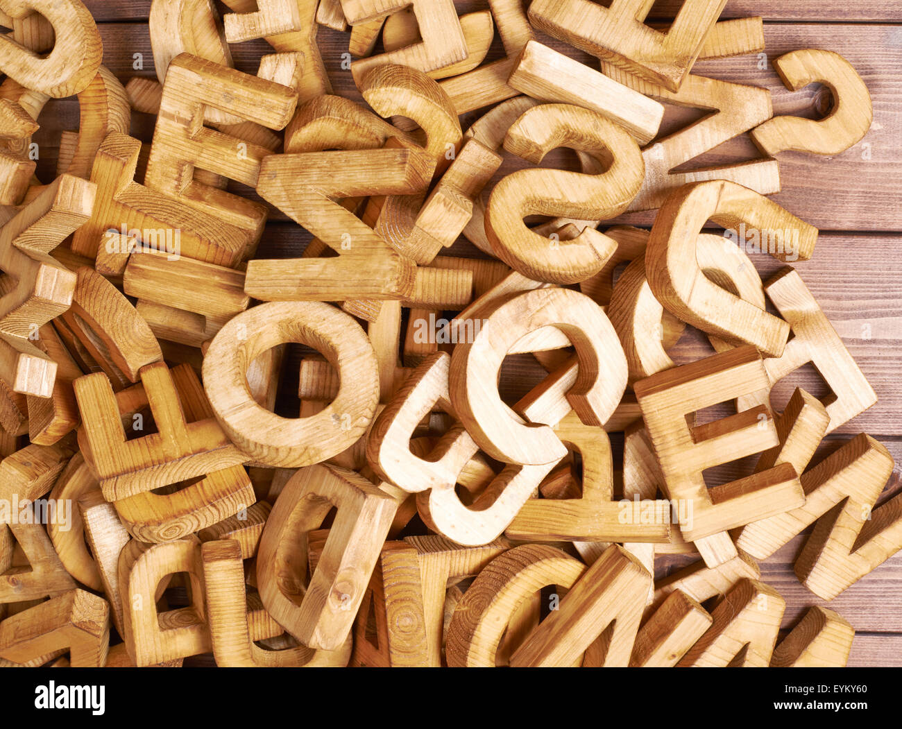 Surface covered with multiple wooden letters Stock Photo - Alamy