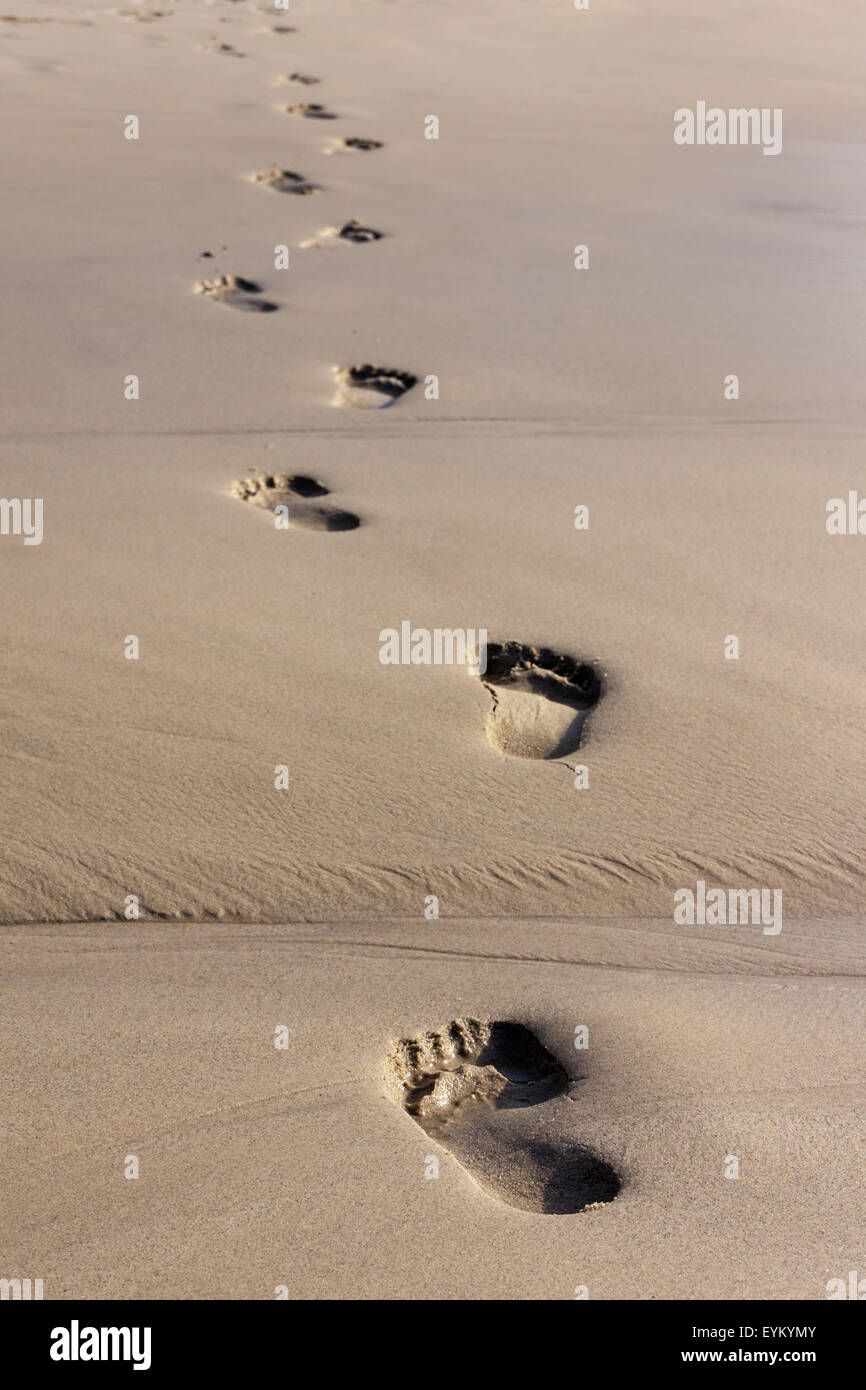 Beach, footprints at sand Stock Photo - Alamy