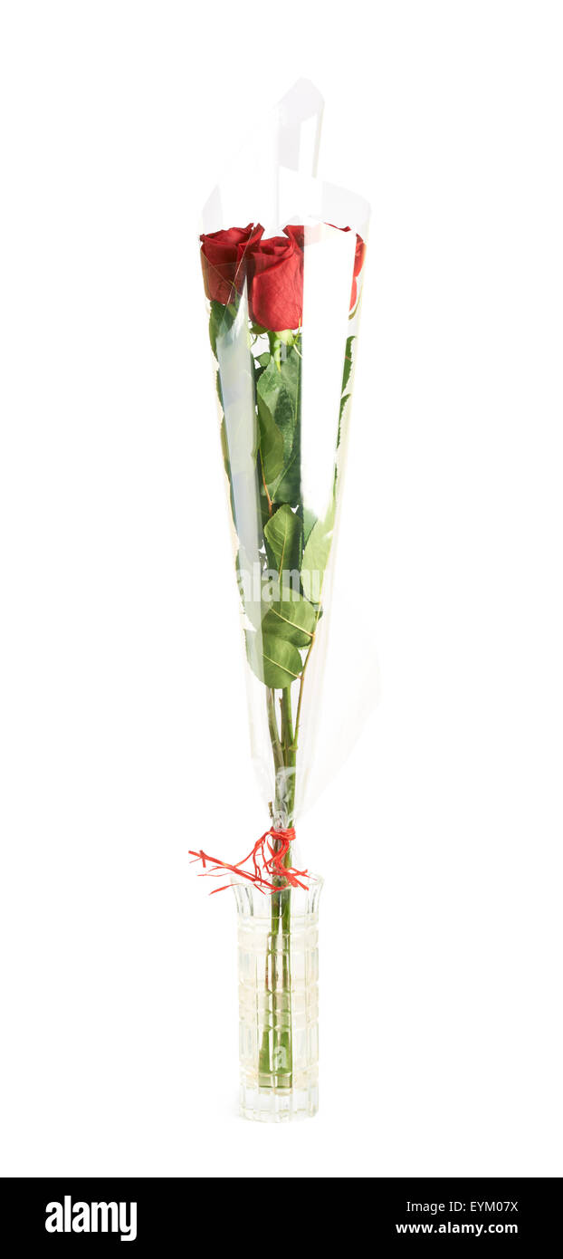 Three red roses in a vase Stock Photo - Alamy