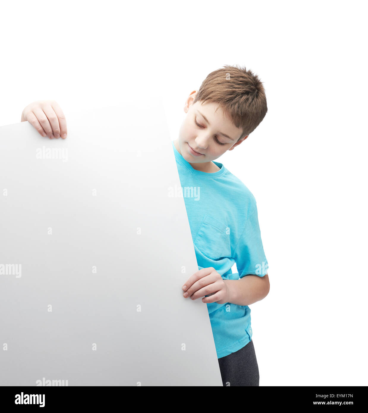 Smiling young boy with a sheet of paper Stock Photo - Alamy