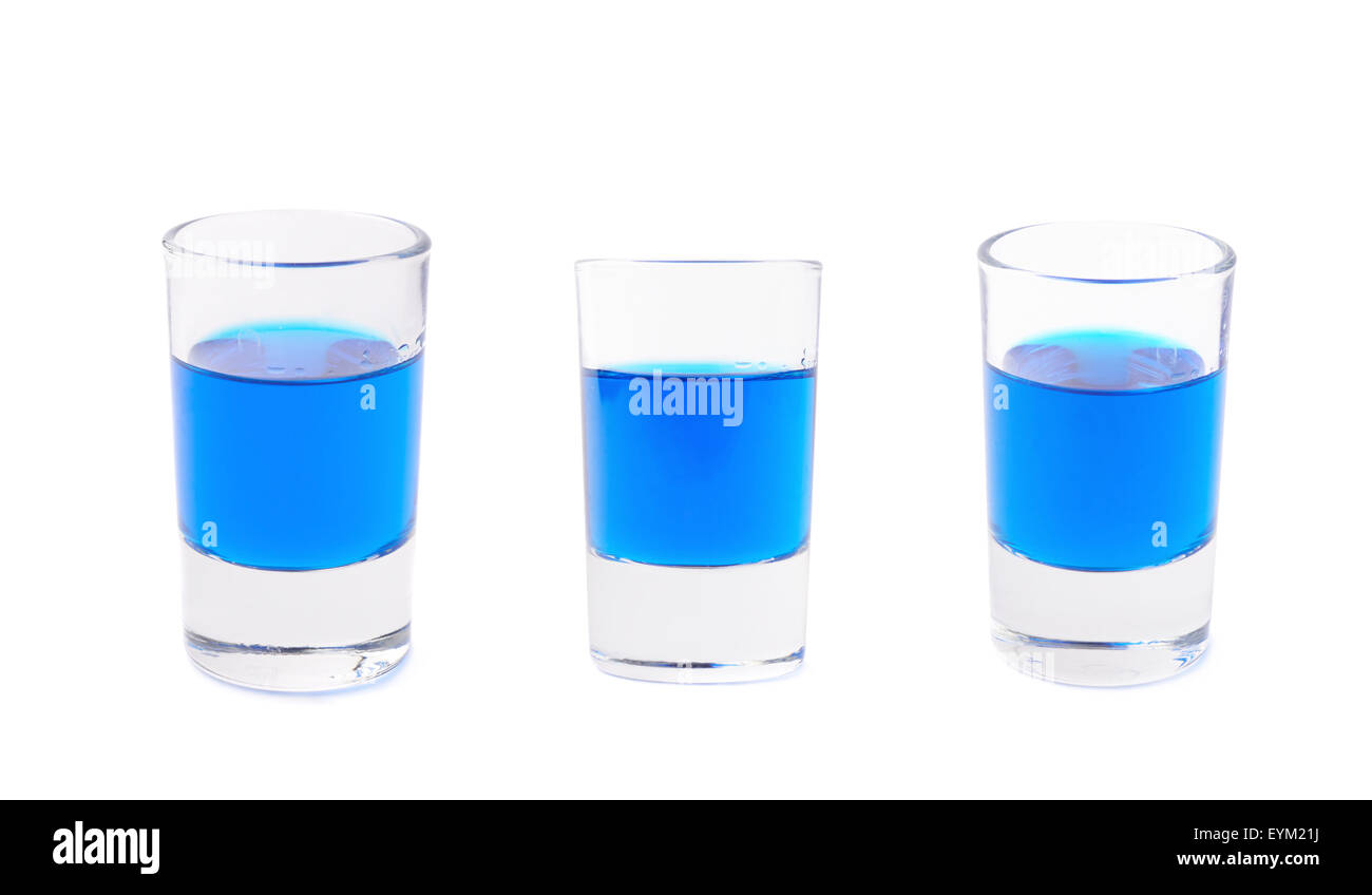 Small glass shot filled with liqueur isolated Stock Photo - Alamy