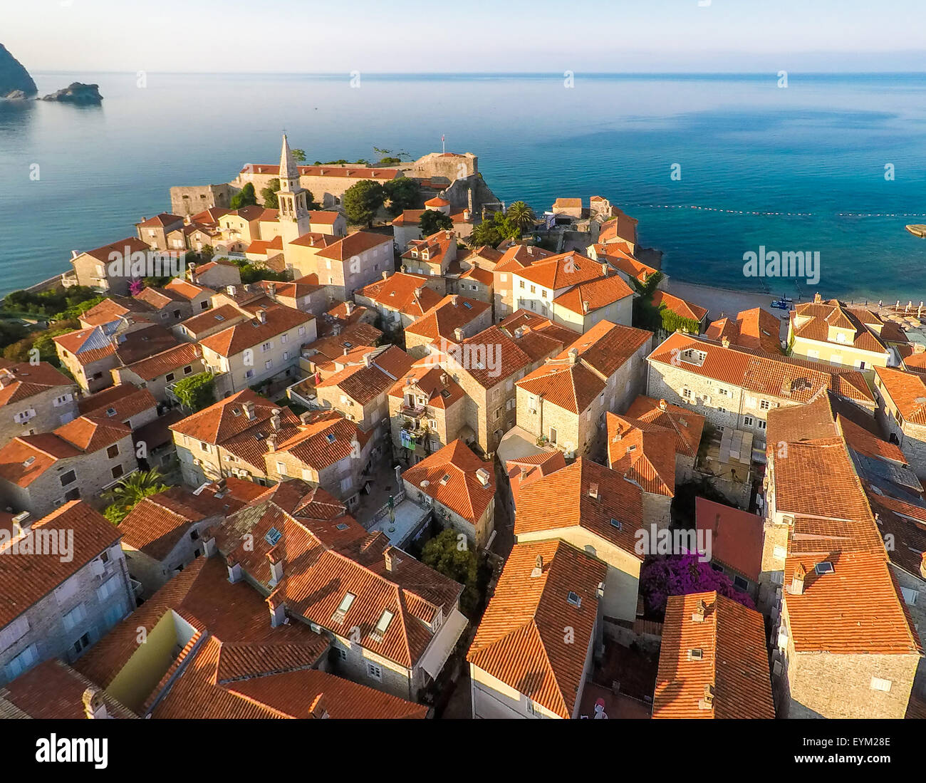 View of old town Budva from the top: Ancient walls and tiled roof of ...