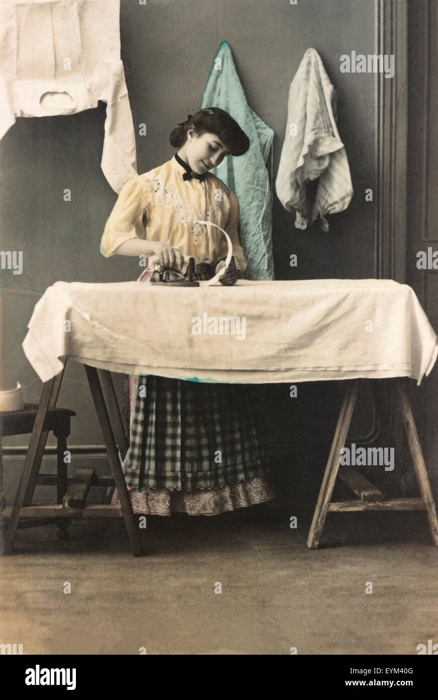 Postcard, historically, woman with the ironing Stock Photo - Alamy