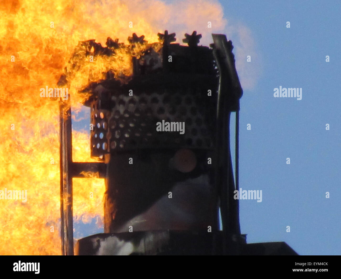 System of a torch on an oil field. Burning through a torch head Stock ...