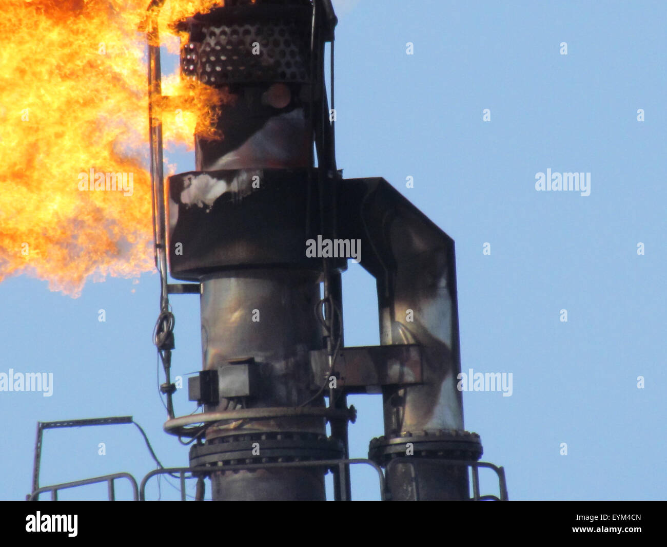System of a torch on an oil field. Burning through a torch head Stock ...