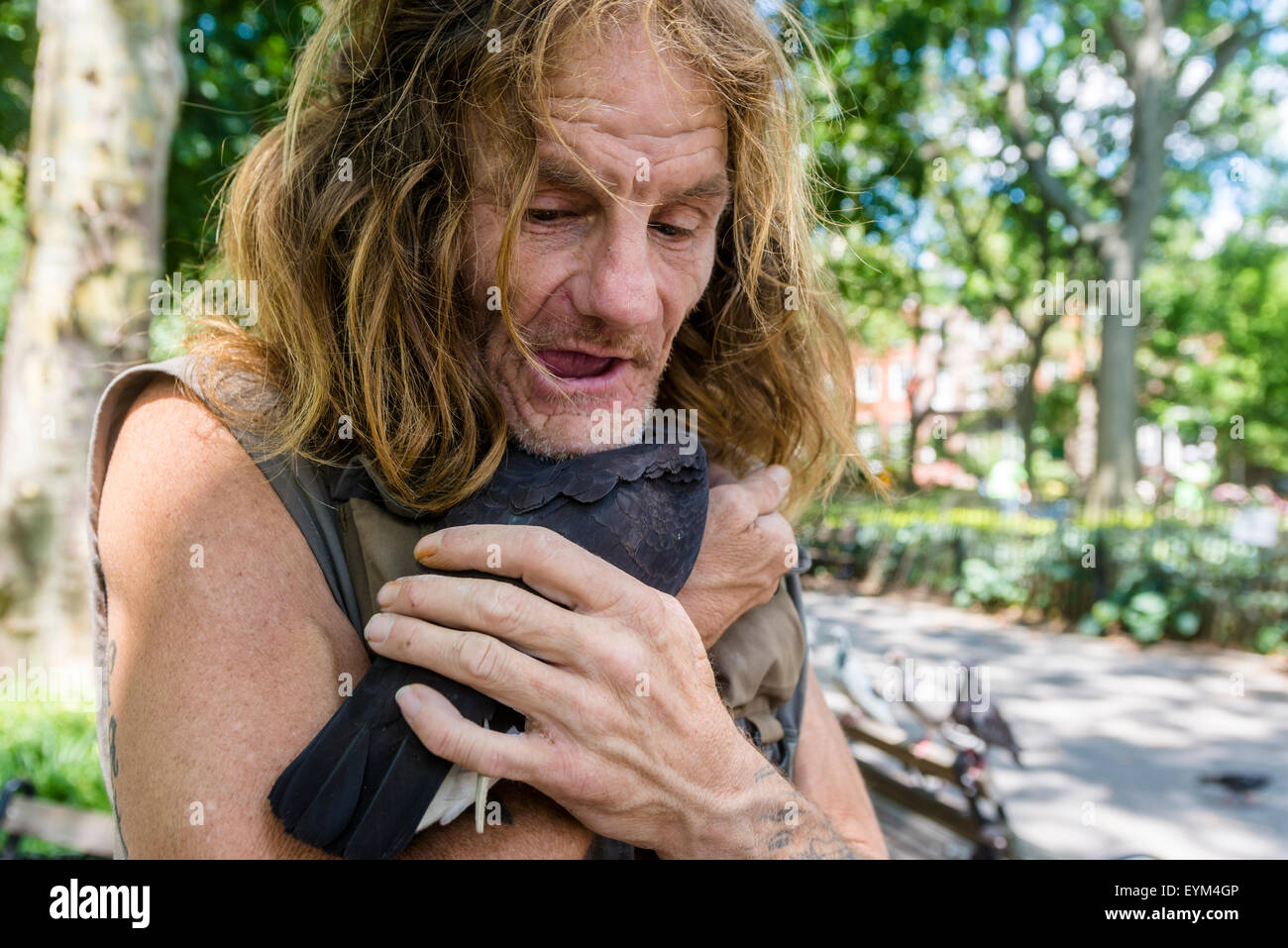 New York, NY - 31 July 2015 - Larry the Birdman cuddles one of the ...
