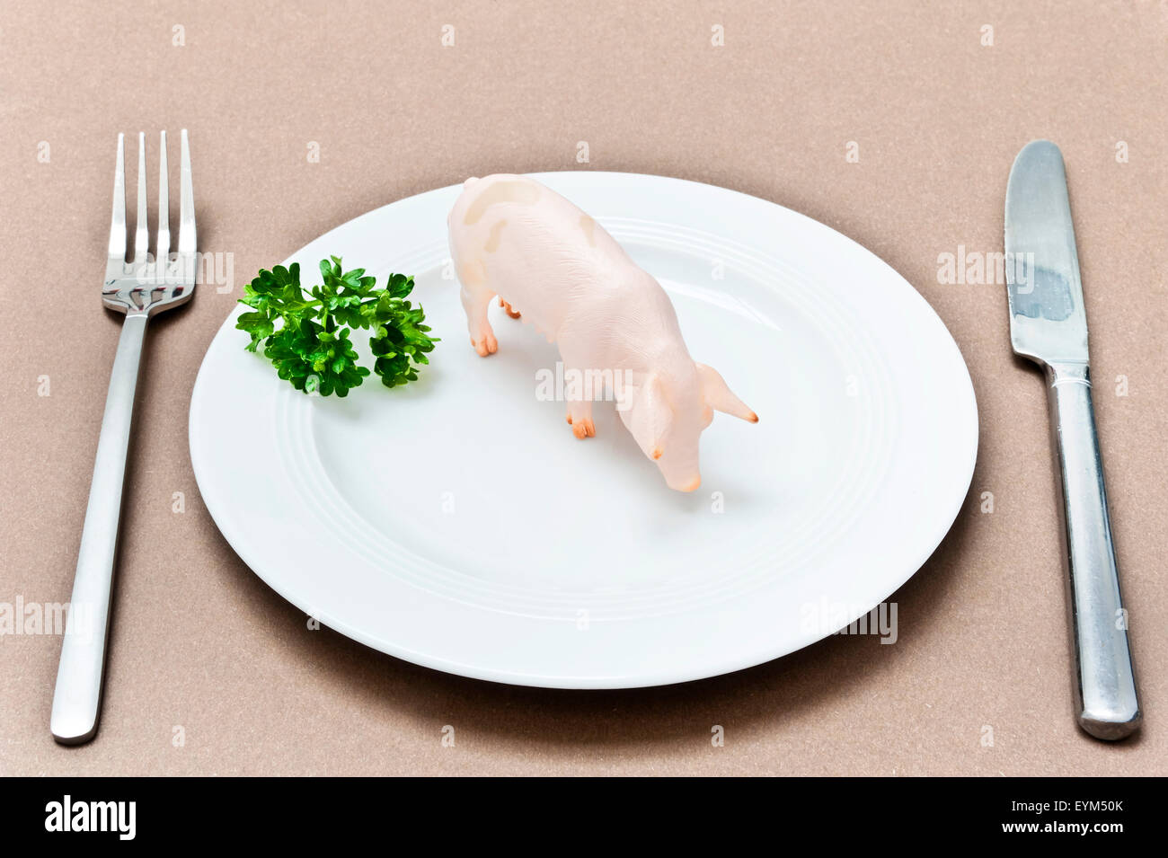 Animal figure, pig, food, plate, fork, knife, cutlery Stock Photo - Alamy