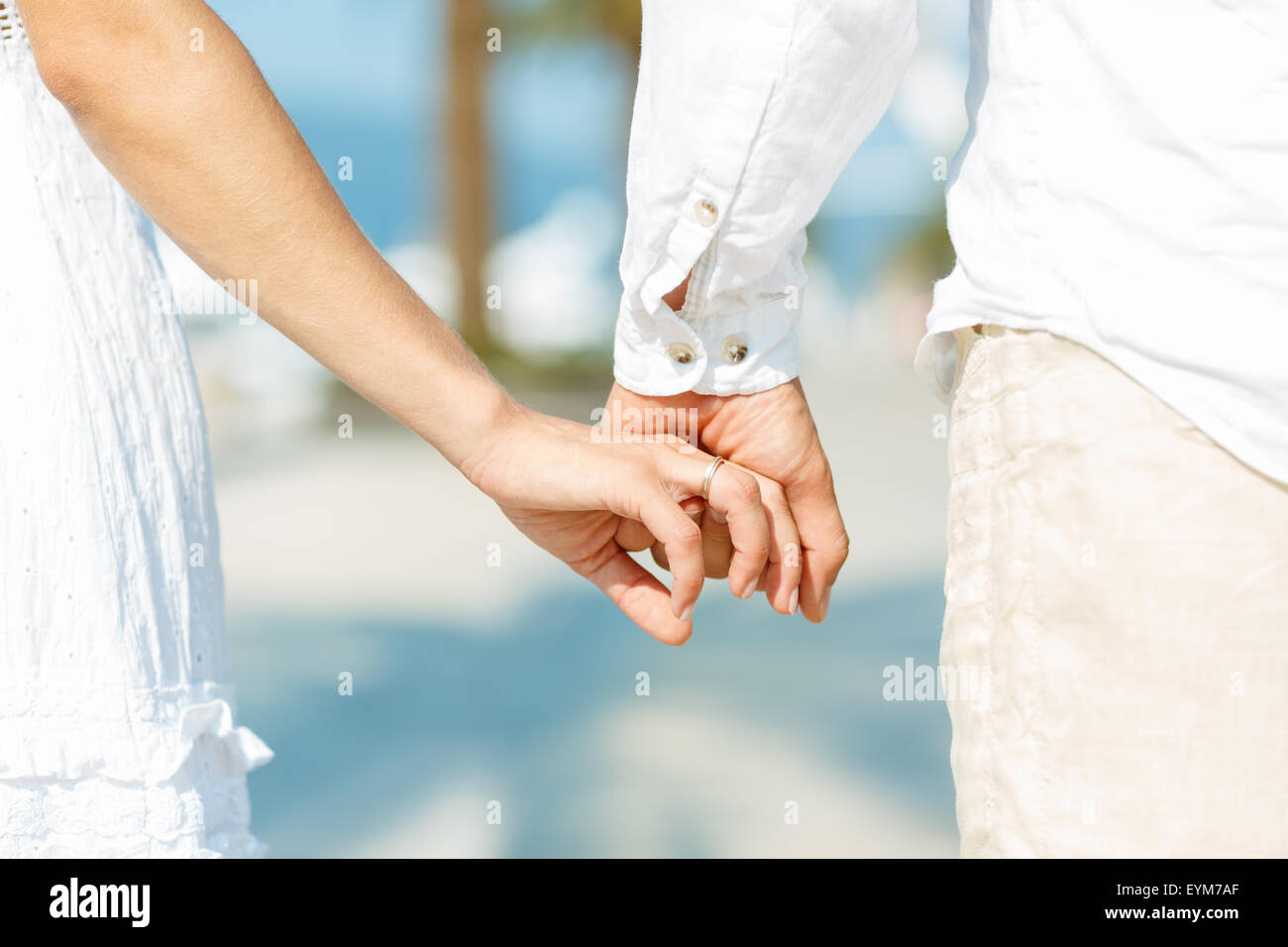 Concept shoot of friendship and love of man and woman: two hands over ...