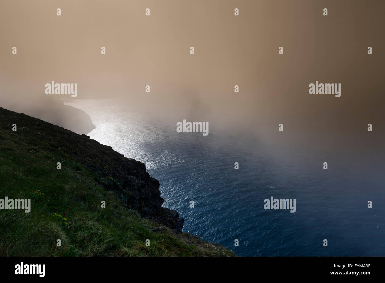 Cliff with fog Stock Photo - Alamy