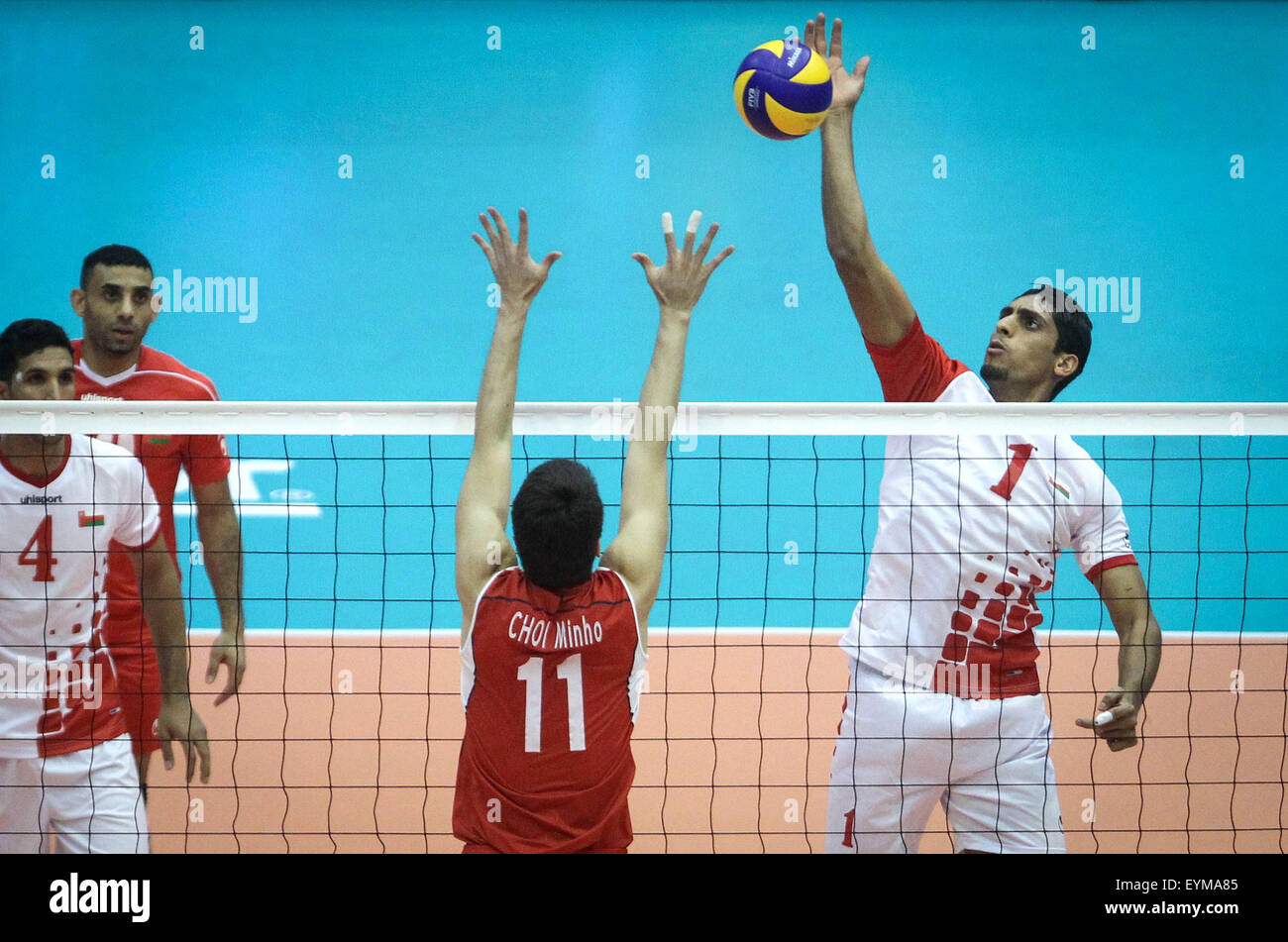 Tehran, Iran. 31st July, 2015. Saud Almamari (R) of Oman spikes the ball during the match ...