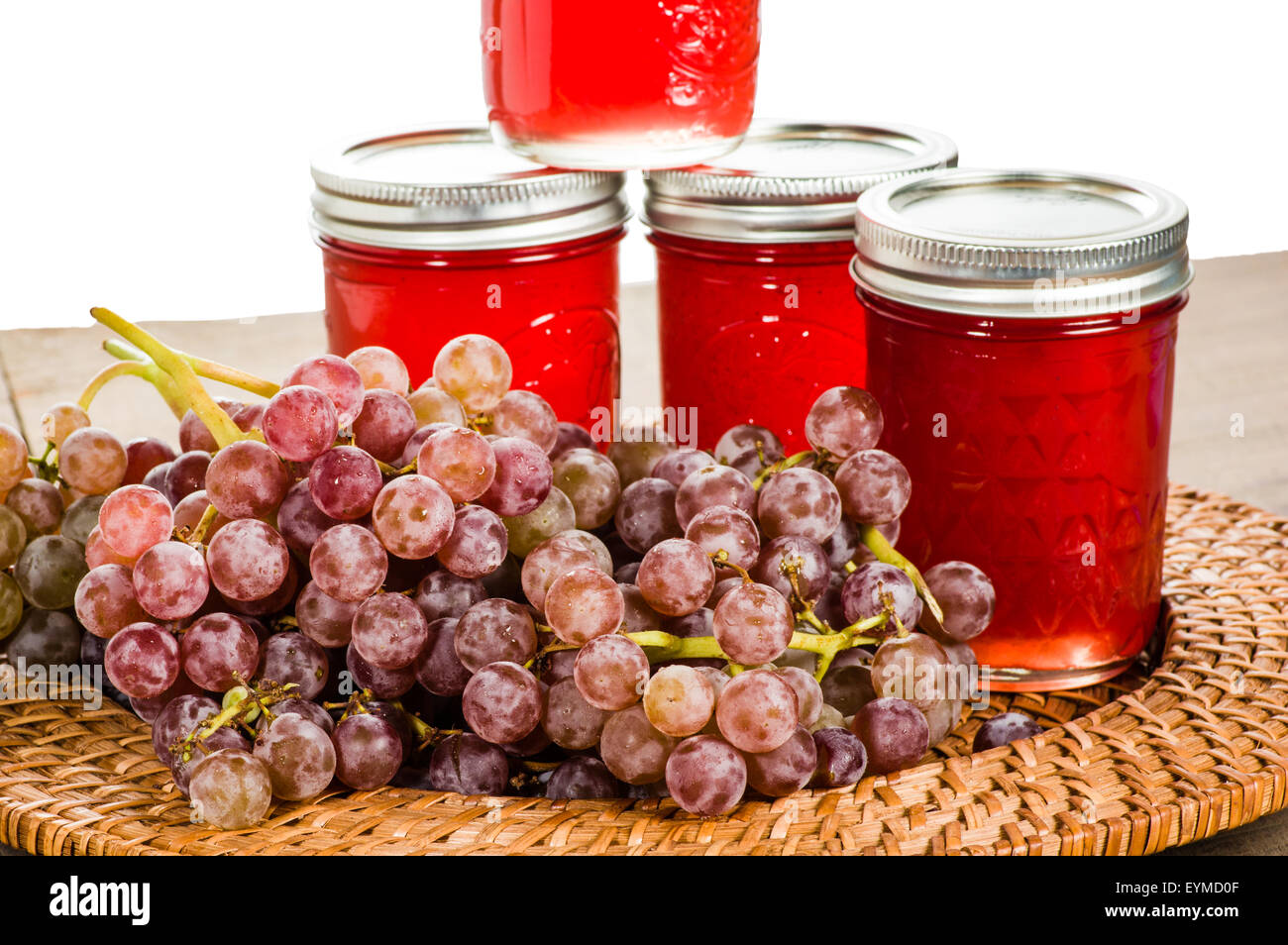 Jars of fresh pink grape jelly with grapes Stock Photo - Alamy