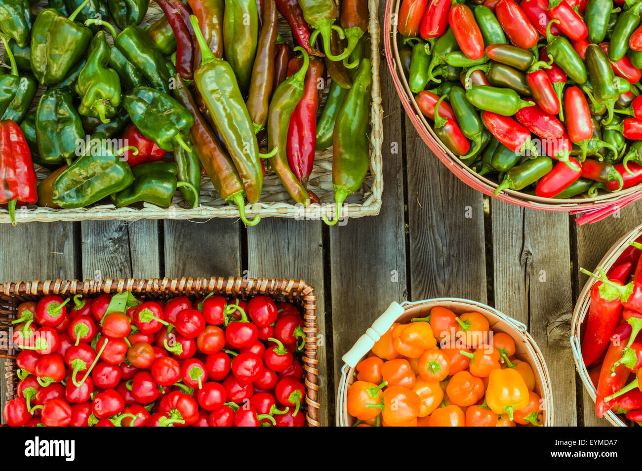 Display of assorted peppers in baskets Stock Photo - Alamy