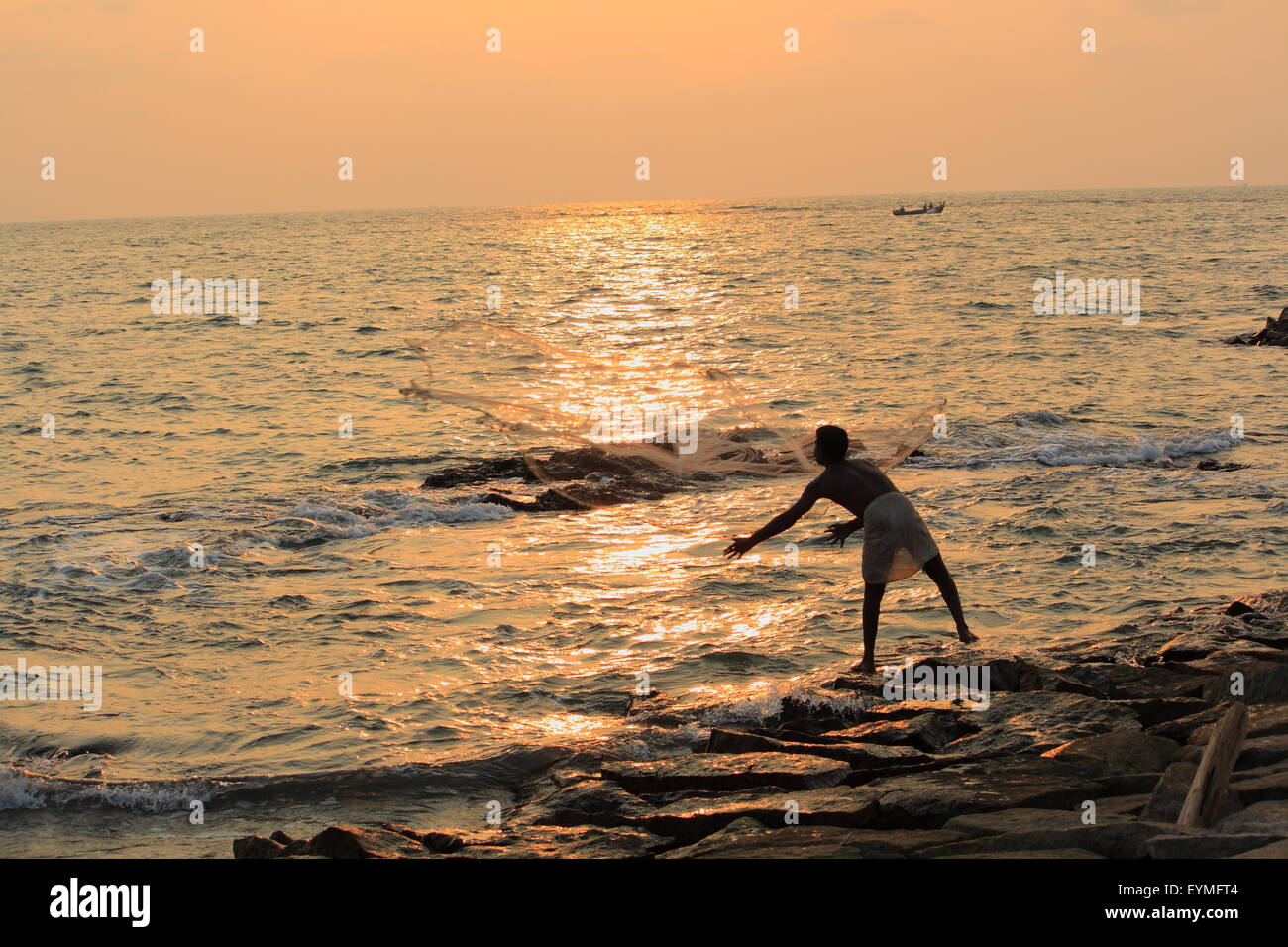 Fisherman Casting Net at sea Kerala, India Stock Photo - Alamy
