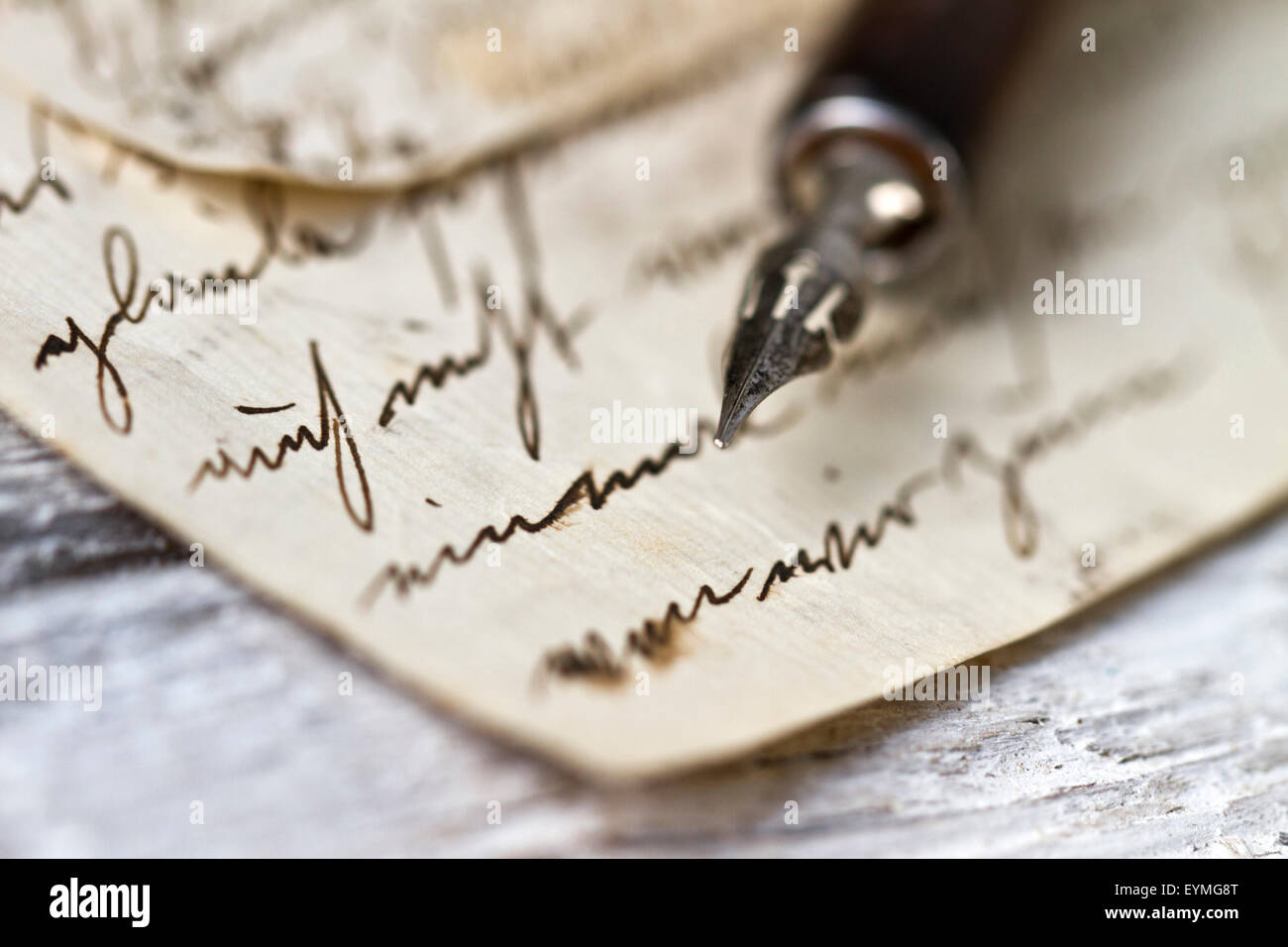 Letters, postcards with writing feather Stock Photo - Alamy