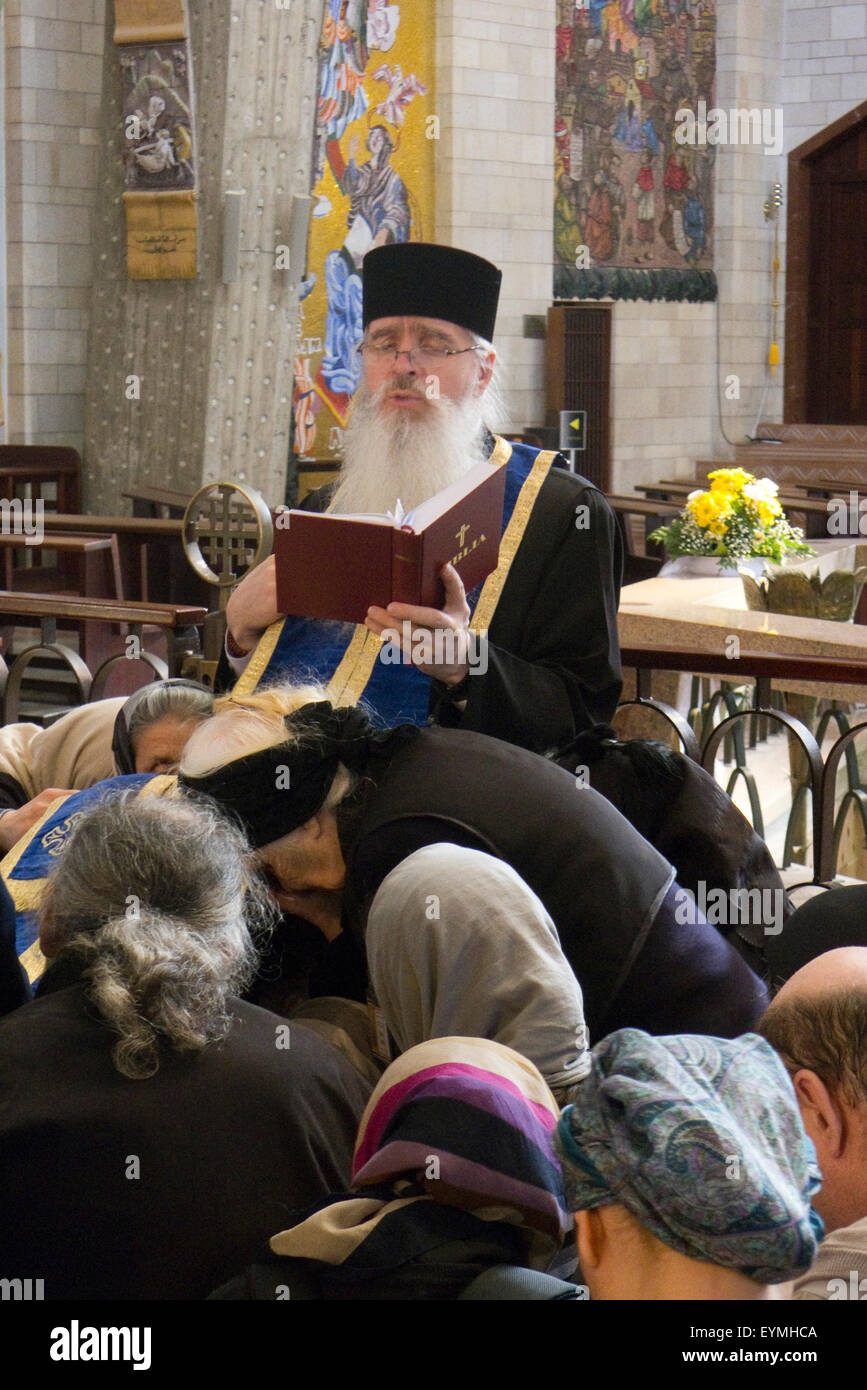 Annunciaton Church, inside, orthodox Christians while praying, Nazareth ...