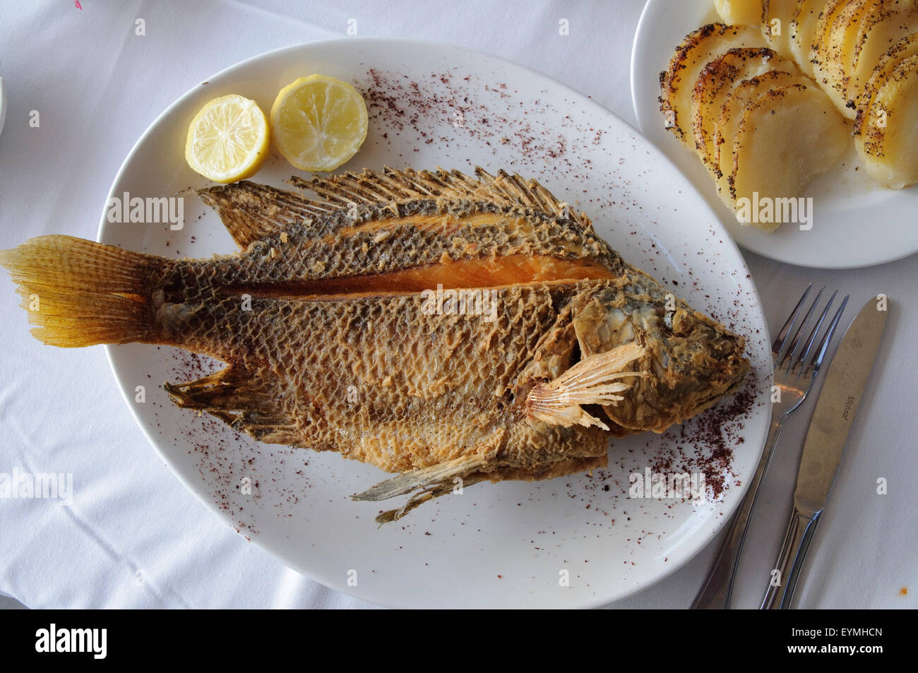 Roasted Saint Peter's fish, Galilee, Israel Stock Photo - Alamy