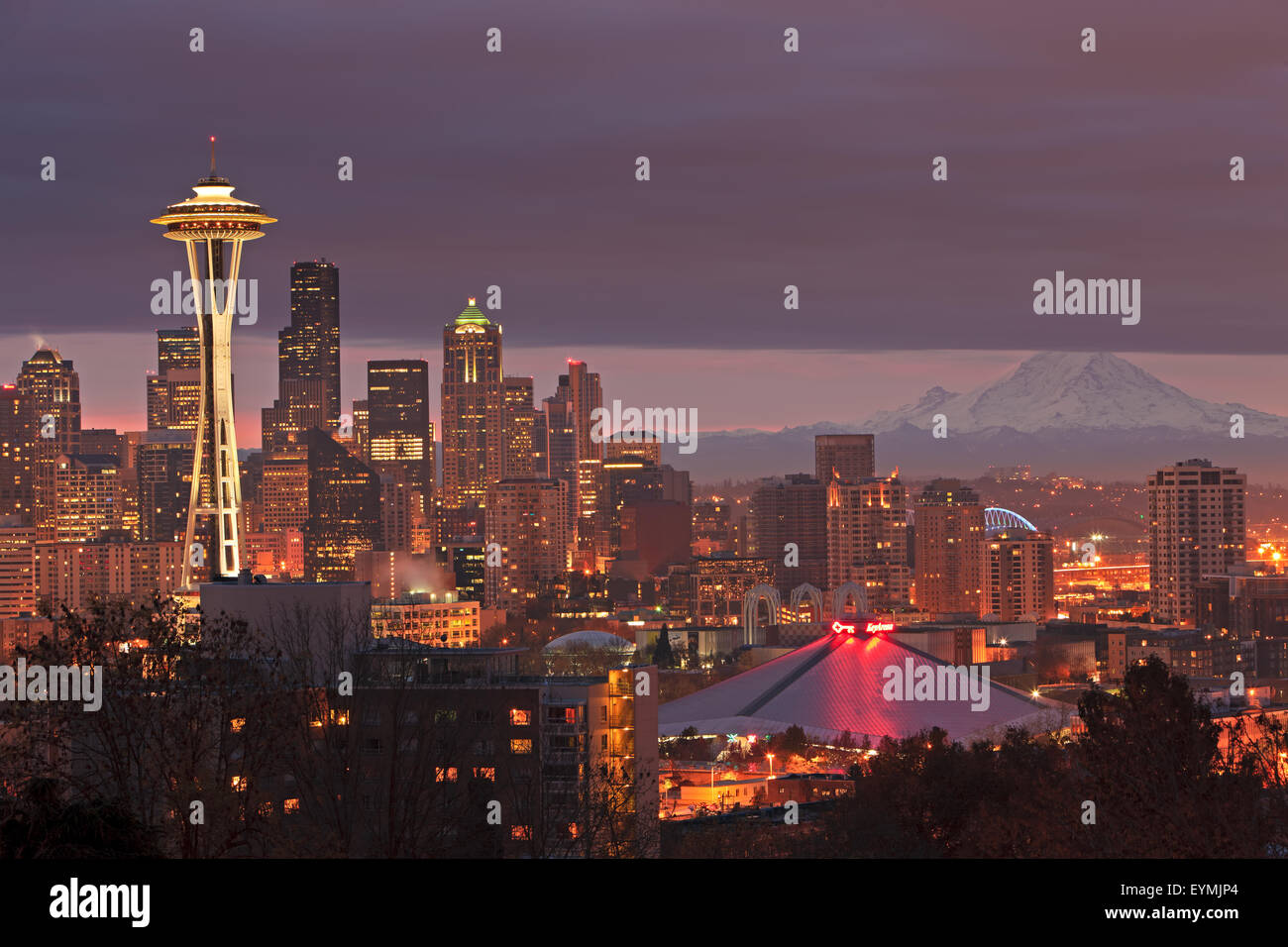 Seattle skyline at twilight with clouds, Mount Rainier in the ...