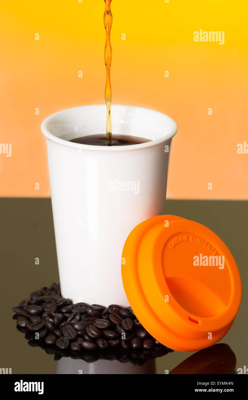 Great image showing stream of coffee pouring into white cup from above ...