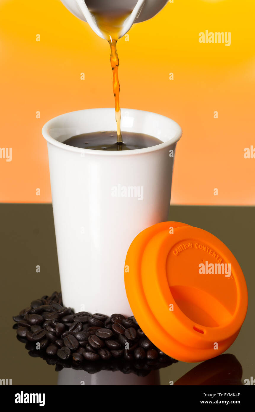 Great image showing stream of coffee pouring into white cup from above ...