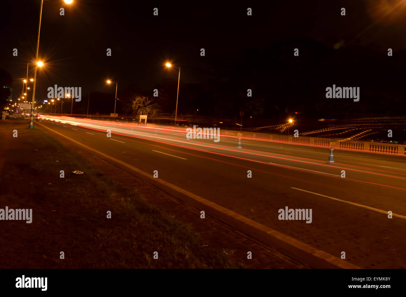 A long exposure of traffic which are going through road Stock Photo - Alamy