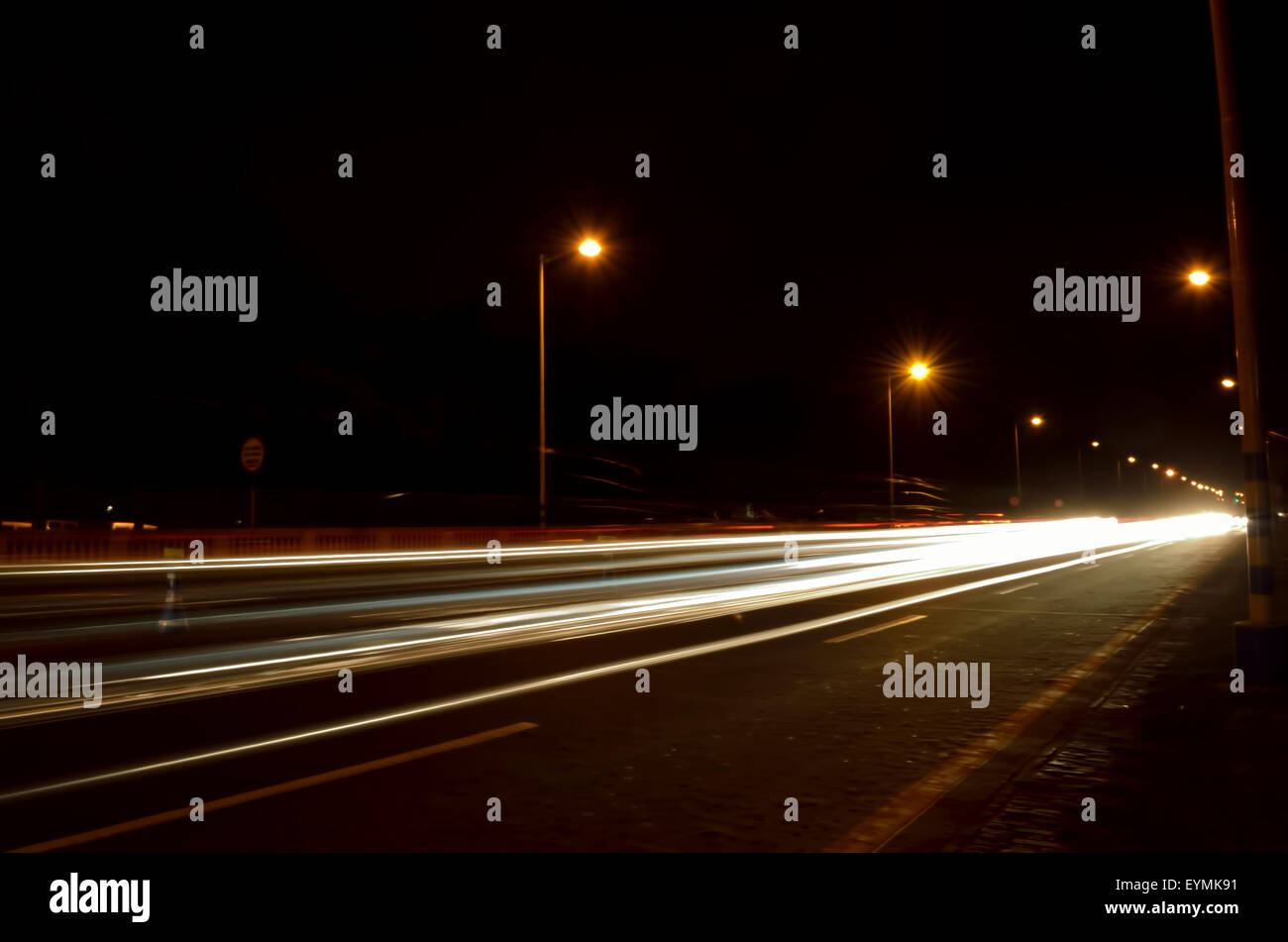A long exposure of traffic which are going through road Stock Photo - Alamy