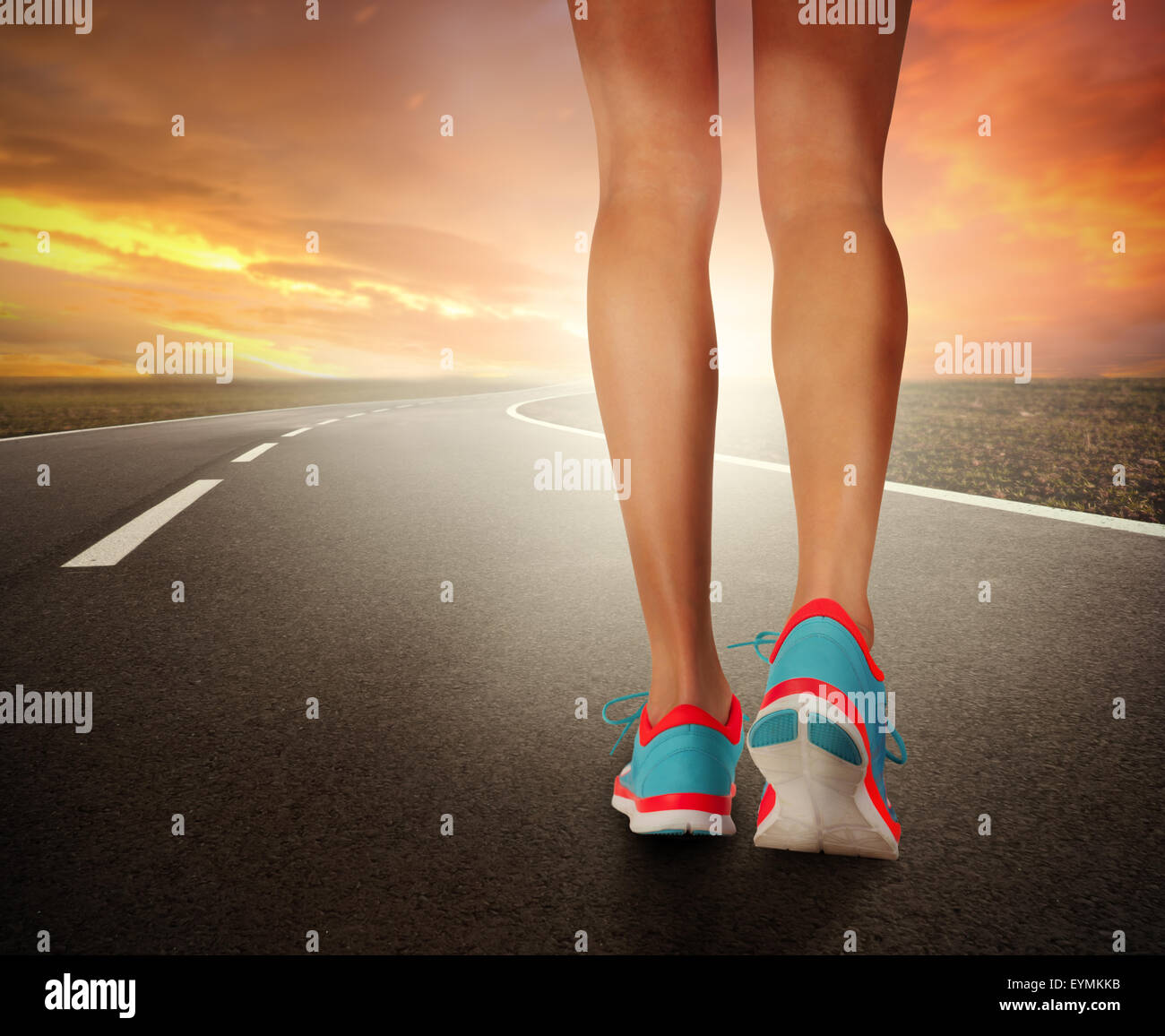 Runner feet running on road Stock Photo - Alamy