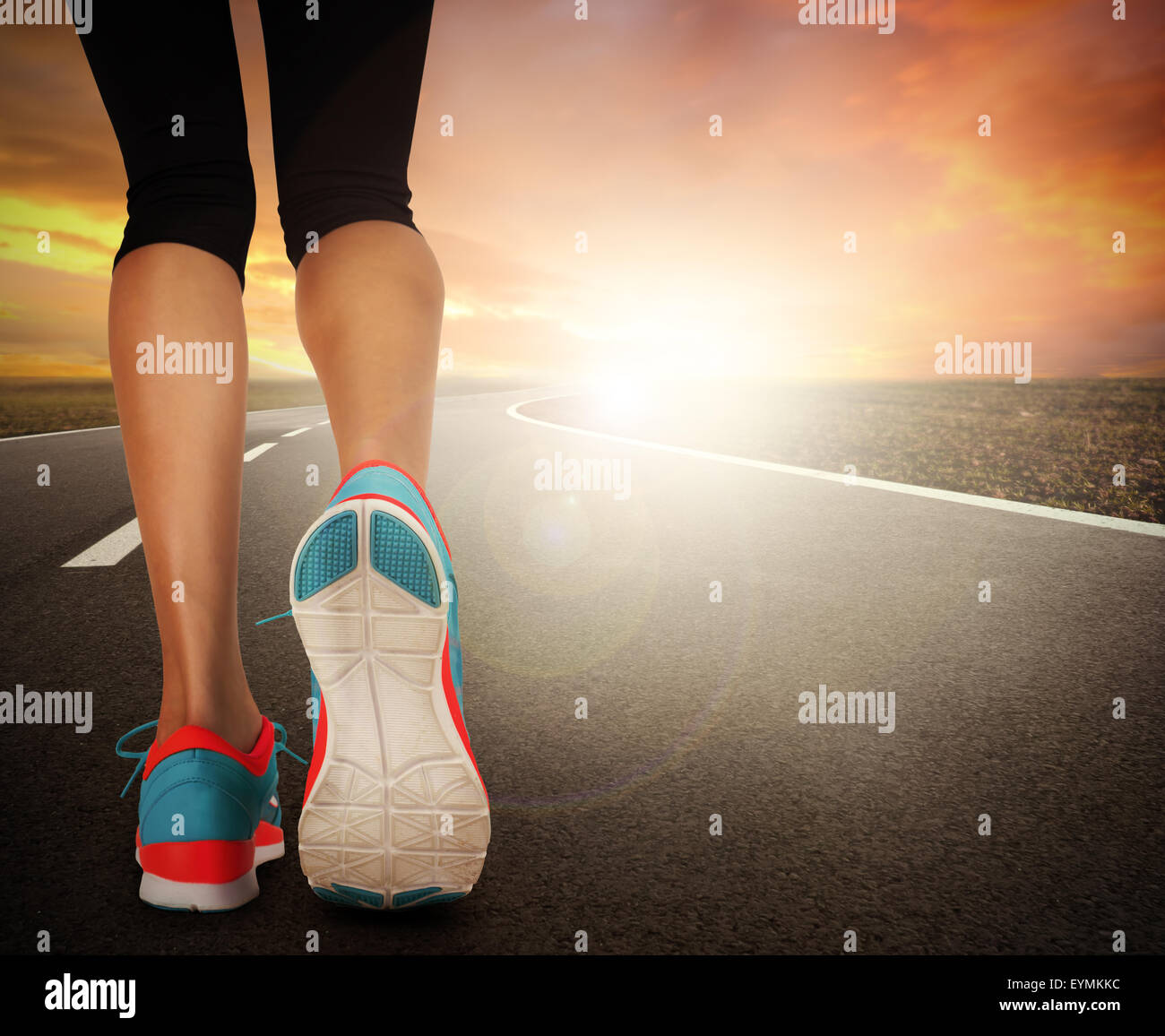 Runner feet running on road Stock Photo - Alamy