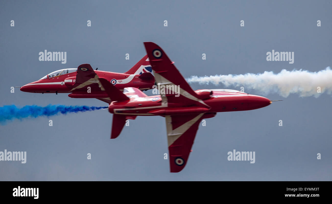 The Red Arrows RAF display team during a formation pass showing smoke ...