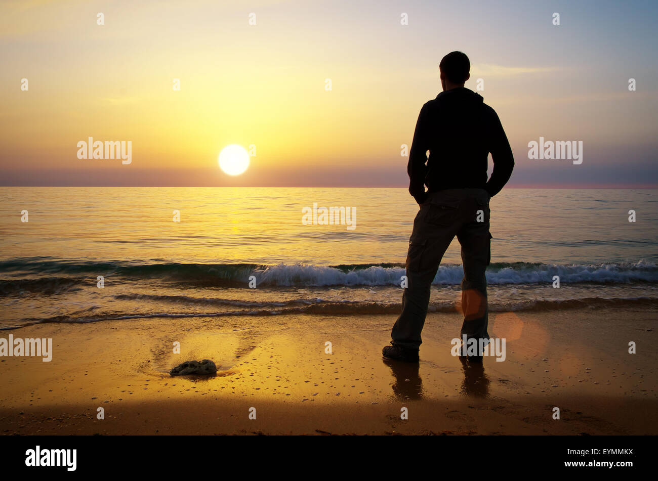 Man on the shore. Relax composition Stock Photo - Alamy