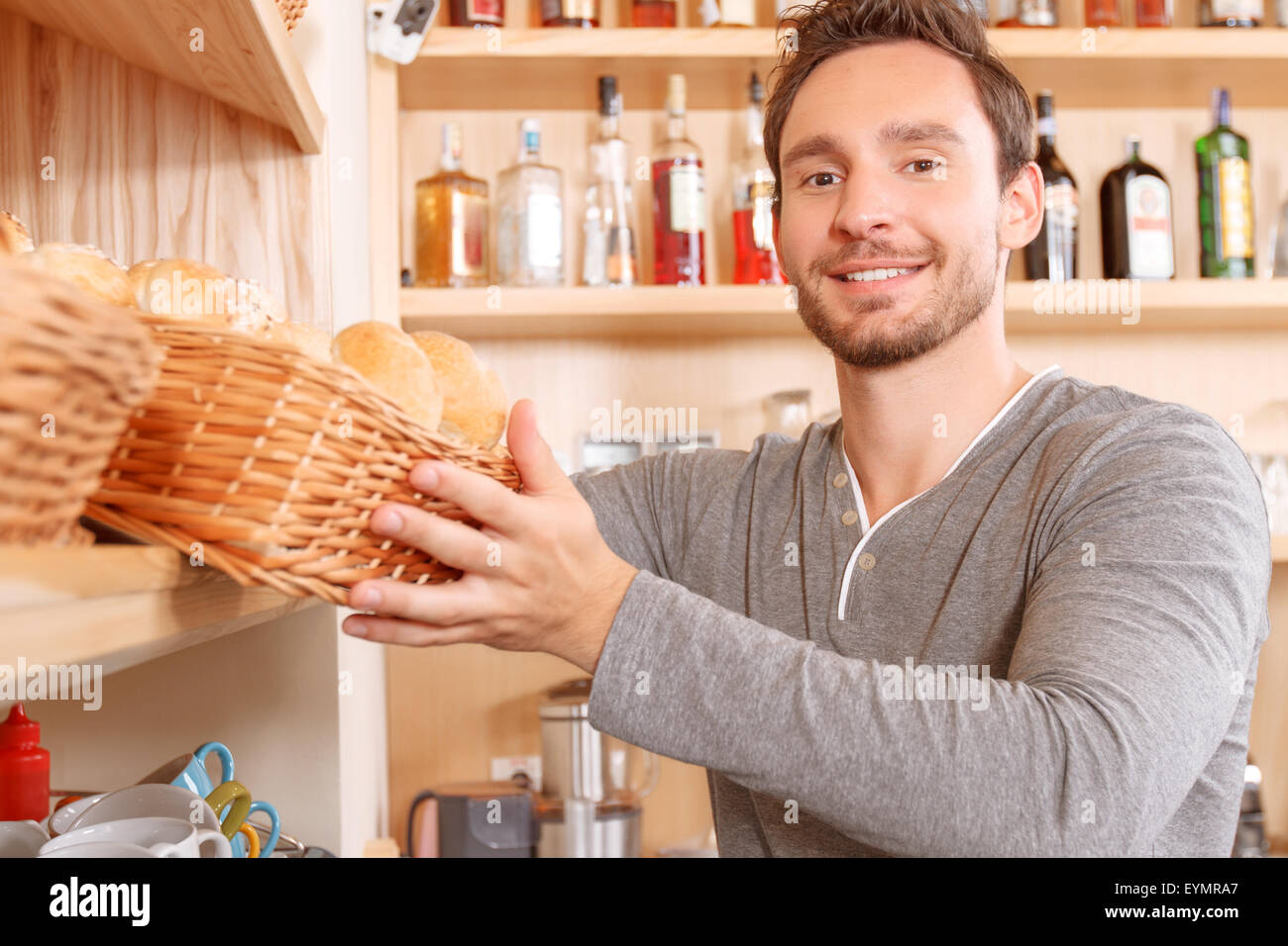 Man setting out goods on stalls Stock Photo - Alamy