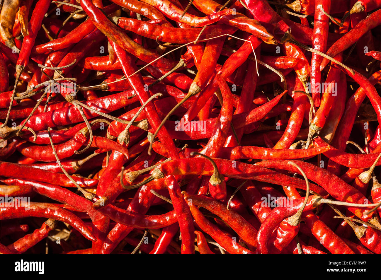 Red spicy chili peppers at asian market close up texture background ...