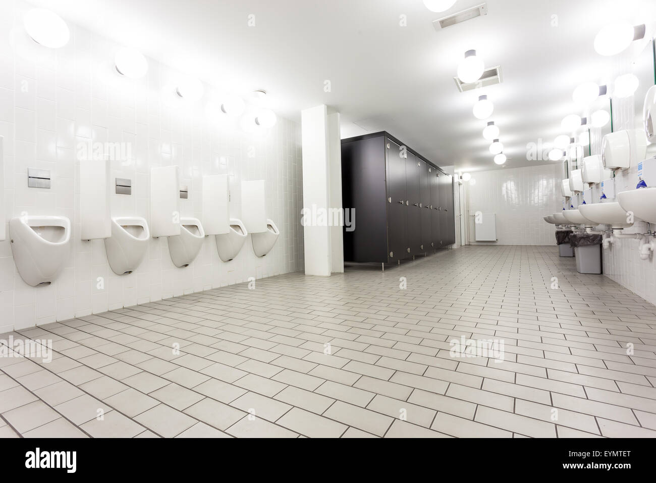 urinals and toilets in an old building for men only Stock Photo - Alamy