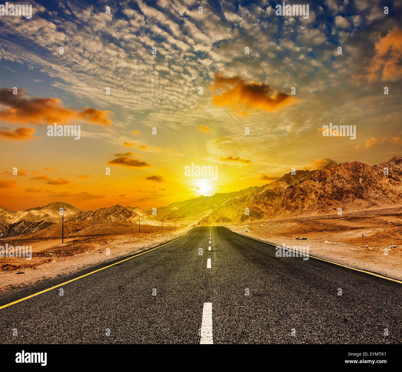 Travel forward concept background - road in Himalayas with mountains and dramatic clouds on ...