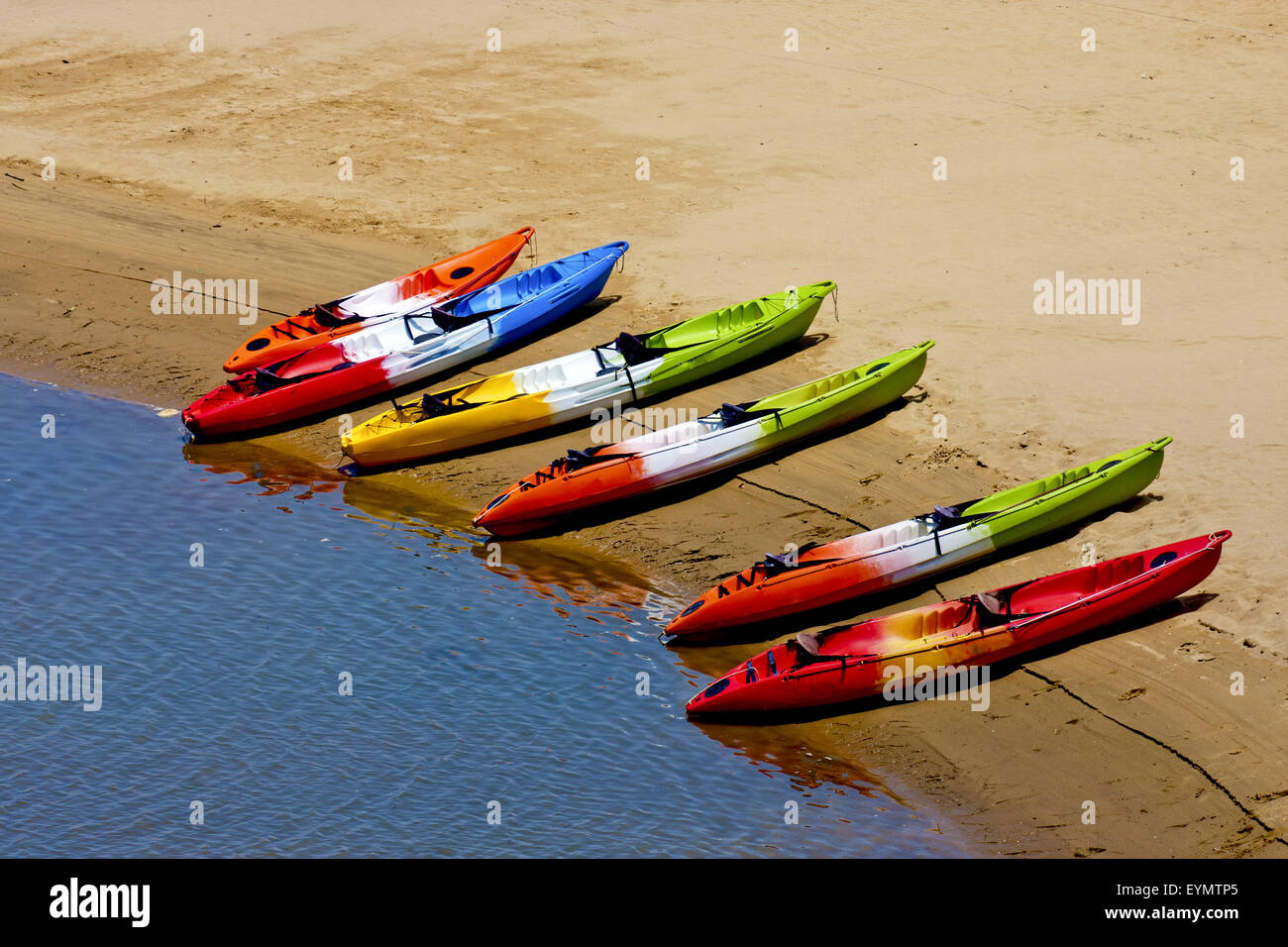 Row colorful boats on beach Stock Photo - Alamy