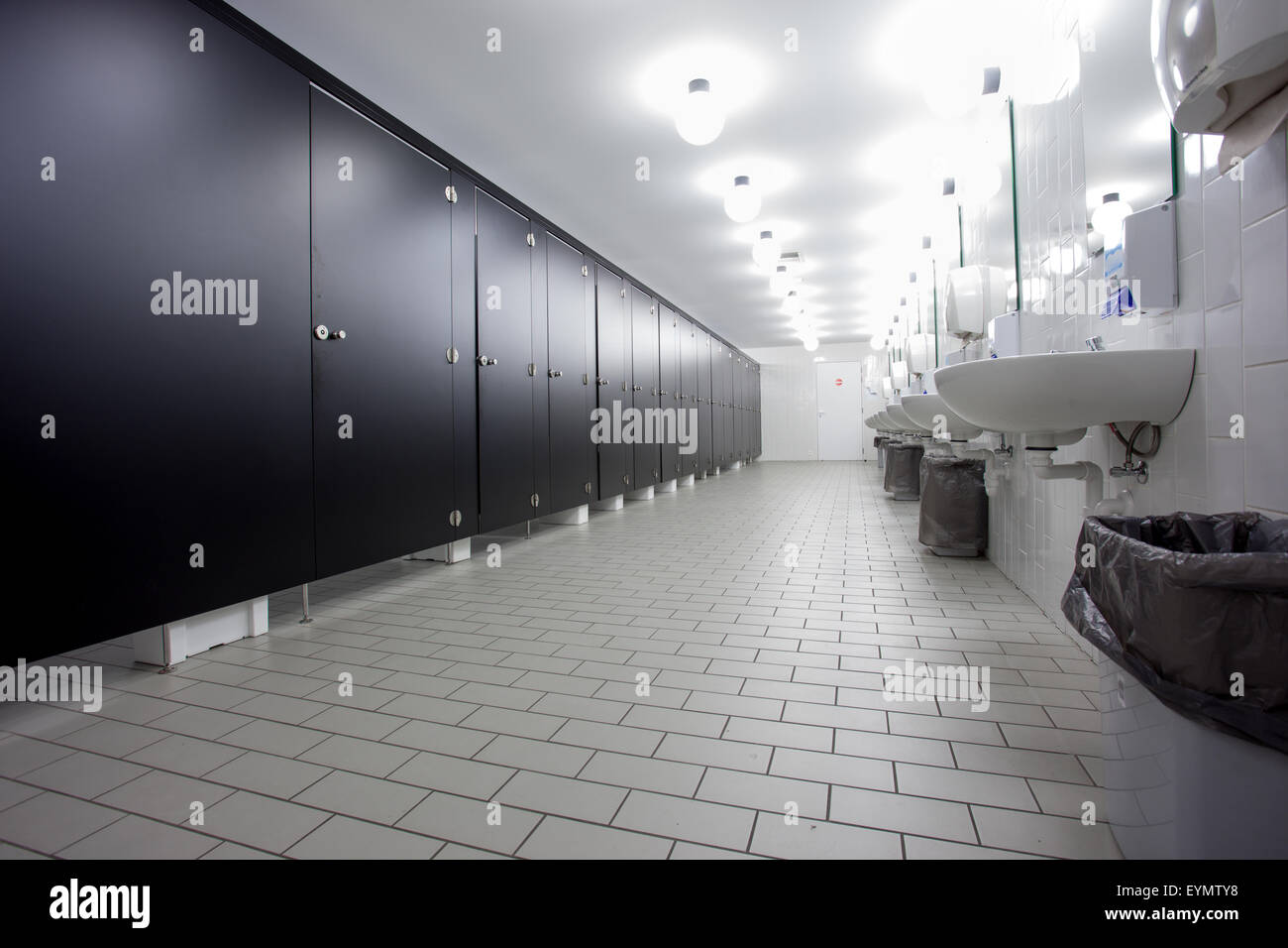Mens restroom in an public building in white and black doors Stock ...