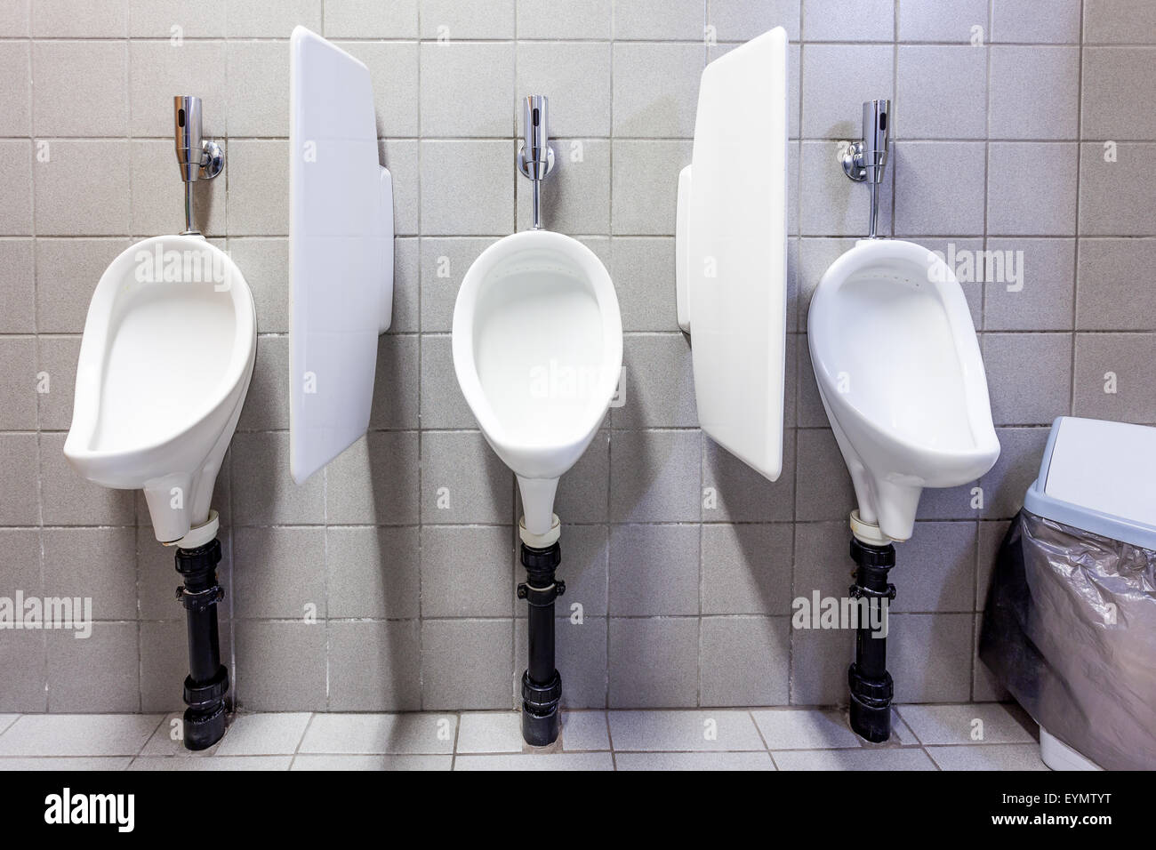 urinals in an old building for men only Stock Photo - Alamy