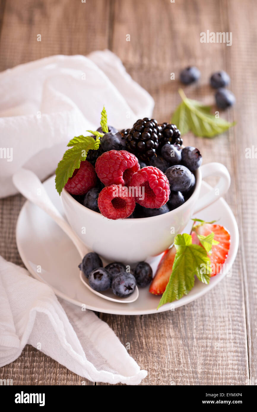 Variety of summer berries in a white cup Stock Photo - Alamy